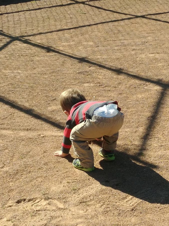 Boy Playing in Dirt on Field Stock Photo - Image of baseball, toddler ...