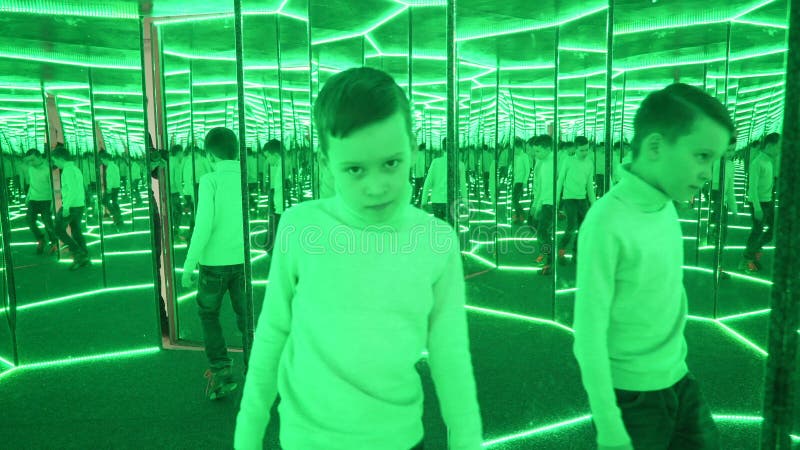 Boy Playing with Distorted Mirror. Museum of Entertaining Sciences ...