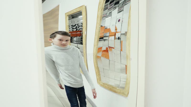 Boy Playing with Distorted Mirror. Museum of Entertaining Sciences ...