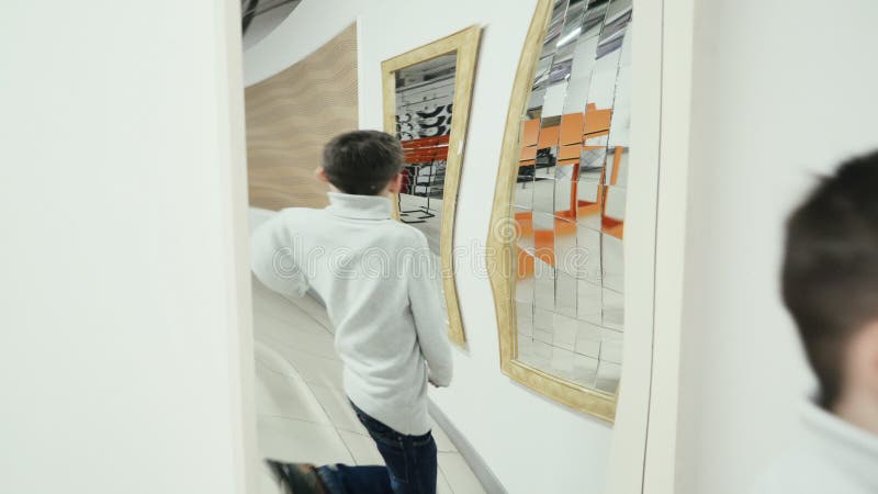 Boy Playing with Distorted Mirror in Museum of Science Stock Video ...