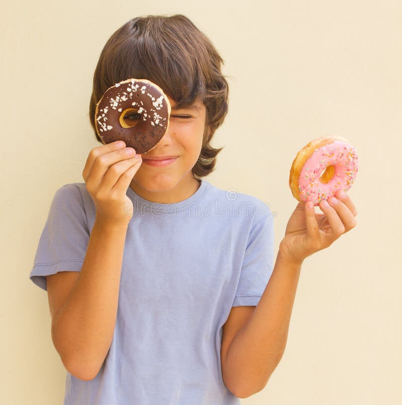 Boy playing with donuts stock photo. Image of happy, childhood - 32682328