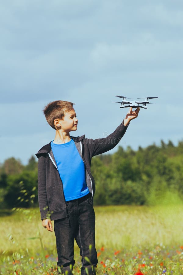 Boy Playing with Drone in the Meadow Stock Photo - Image of hobby ...