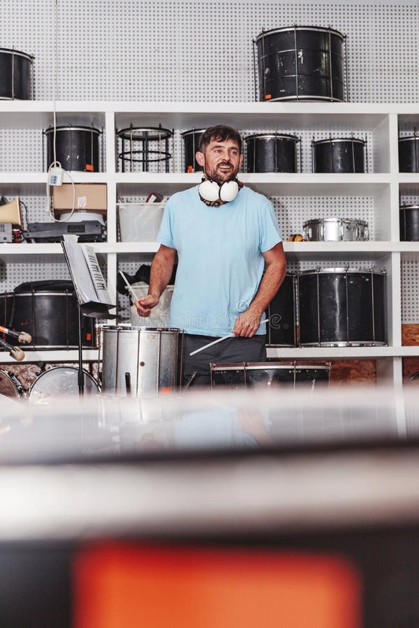 Boy Playing the Drum Inside a Studio Surrounded by Drums Stock Image ...