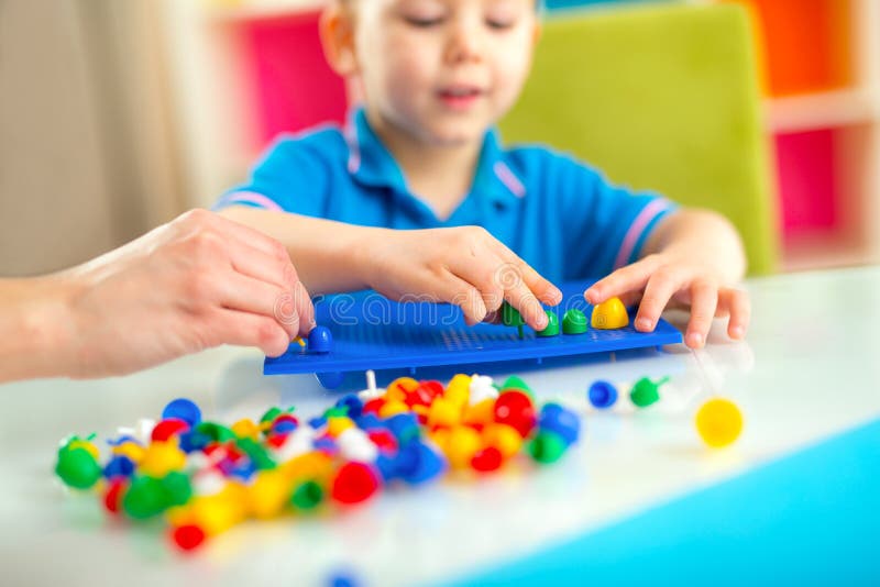 Boy Playing with Educational Toys on a Table Stock Photo - Image of ...