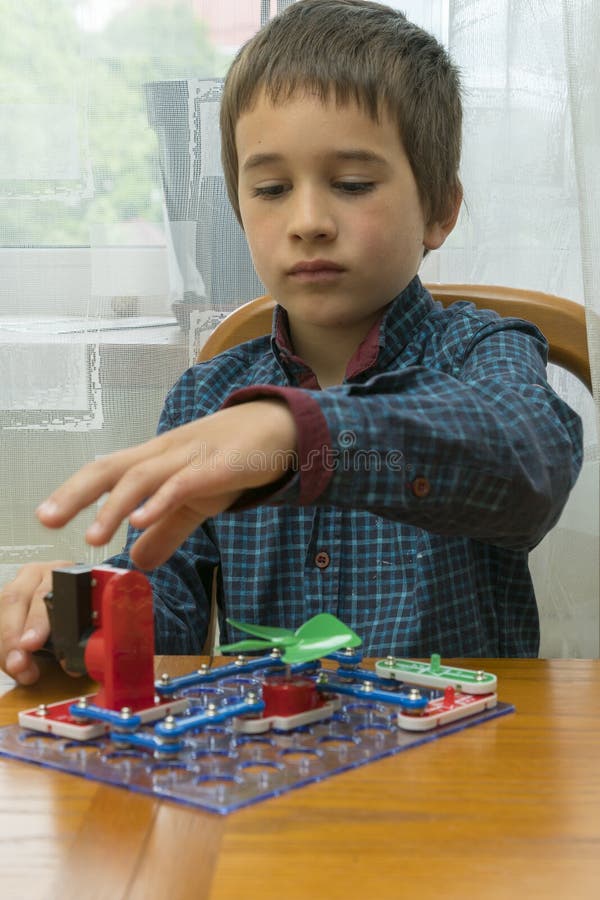The Boy Playing an Electric Constructor. the Child is Played by ...