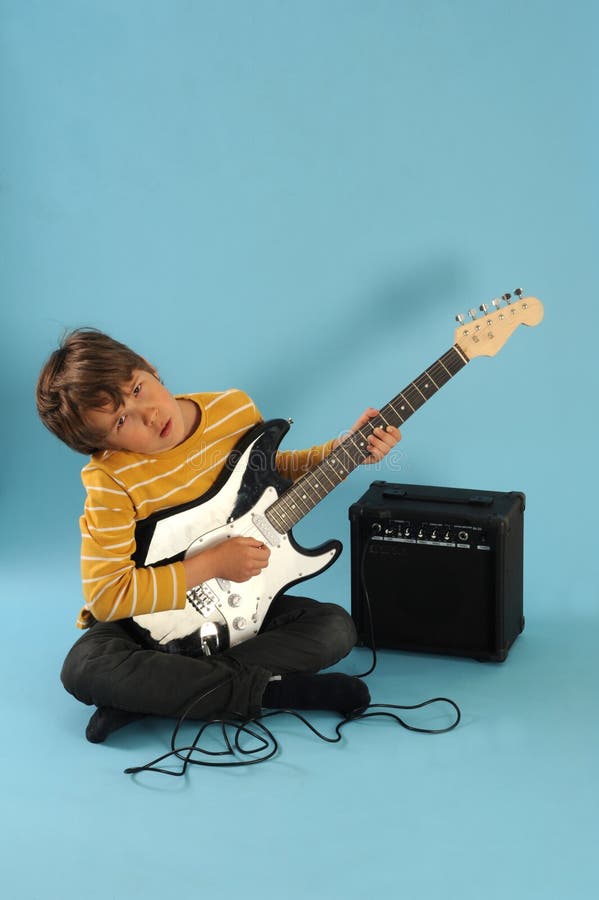 Boy Playing an Electric Guitar Stock Photo - Image of child, music ...