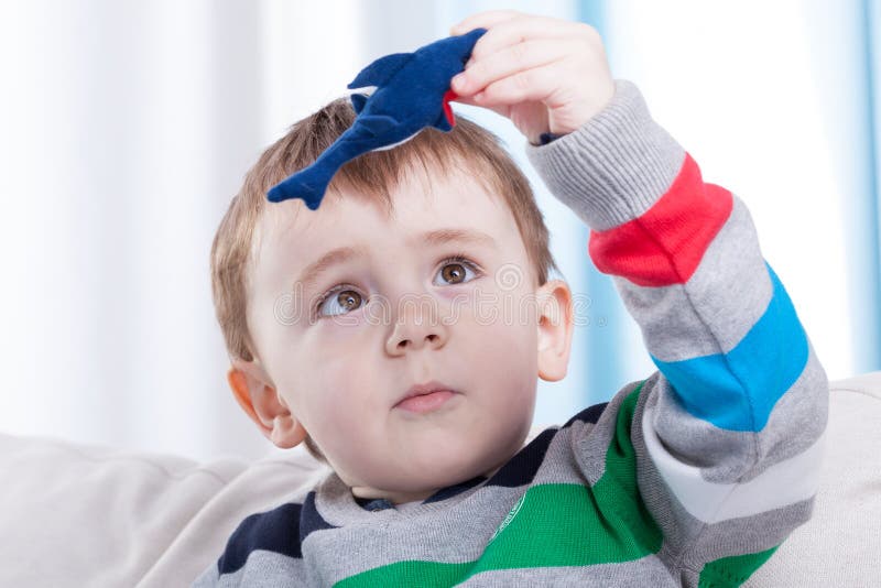 Boy Playing with Favourite Toy Stock Image - Image of living, playing ...