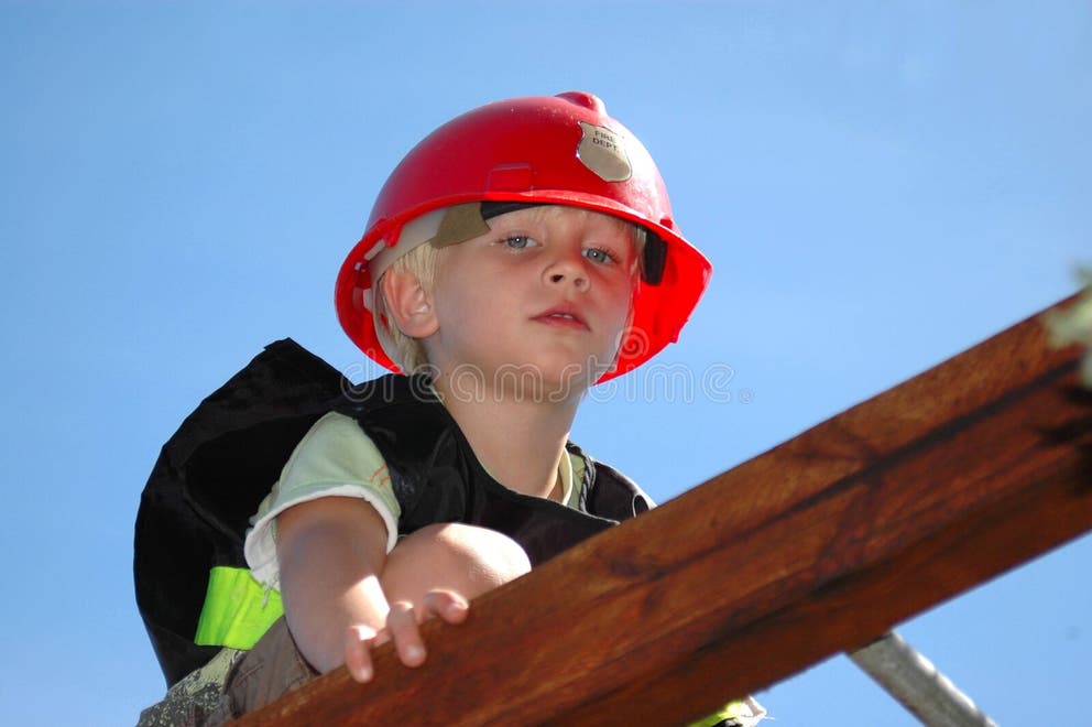 Boy playing firefighter stock image. Image of outside - 3803357