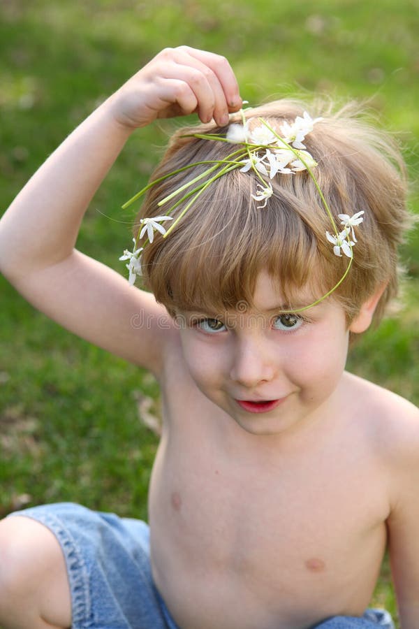 Boy playing with flowers stock photo. Image of hands - 17769442