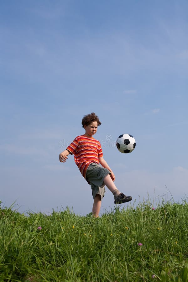 Boy playing football stock image. Image of football, outdoors - 10983201