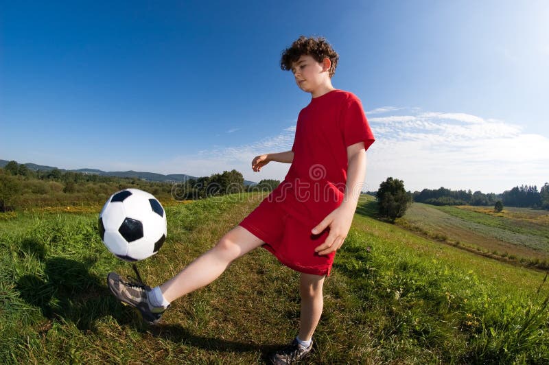 Boy playing football stock image. Image of football, outdoors - 10983201