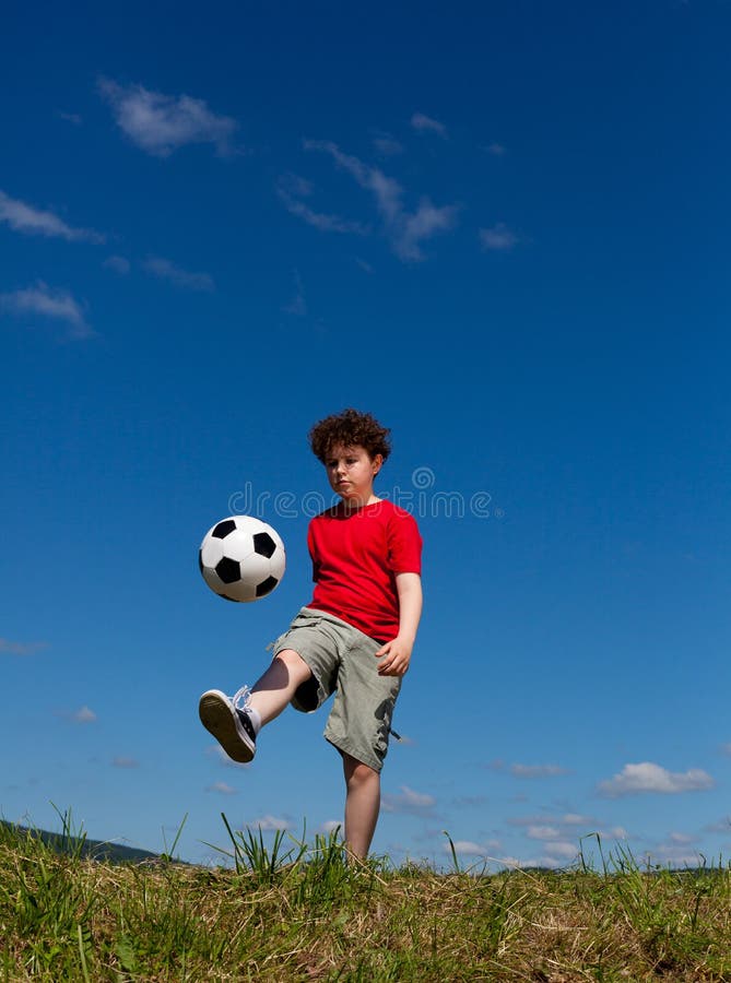 Boy playing football stock image. Image of football, outdoors - 10983201