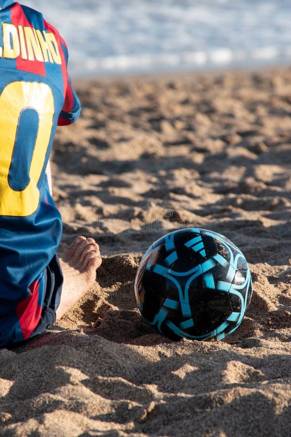 Boy Playing Football in the Beach Stock Photo - Image of beach, blue ...