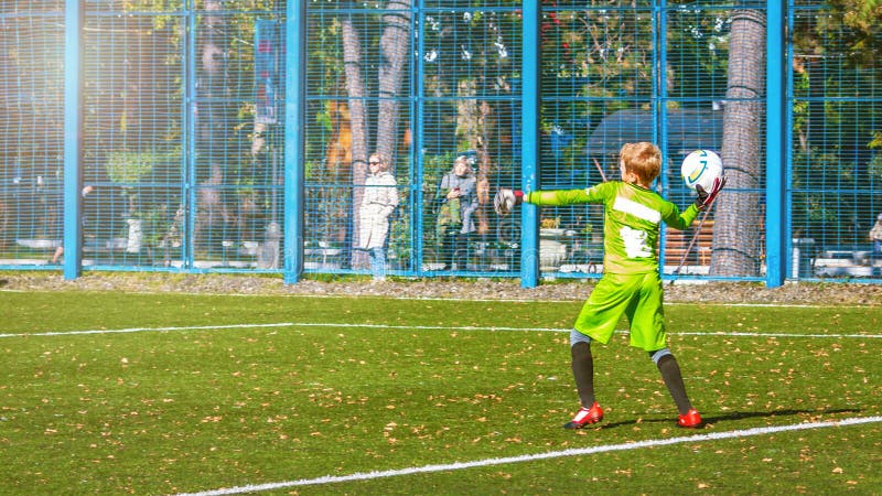 Boy Playing Football on a Training Field Editorial Photo - Image of ...