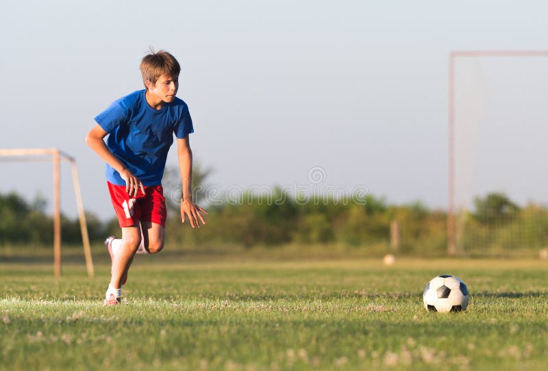 Boy playing football stock image. Image of children, football - 74500169