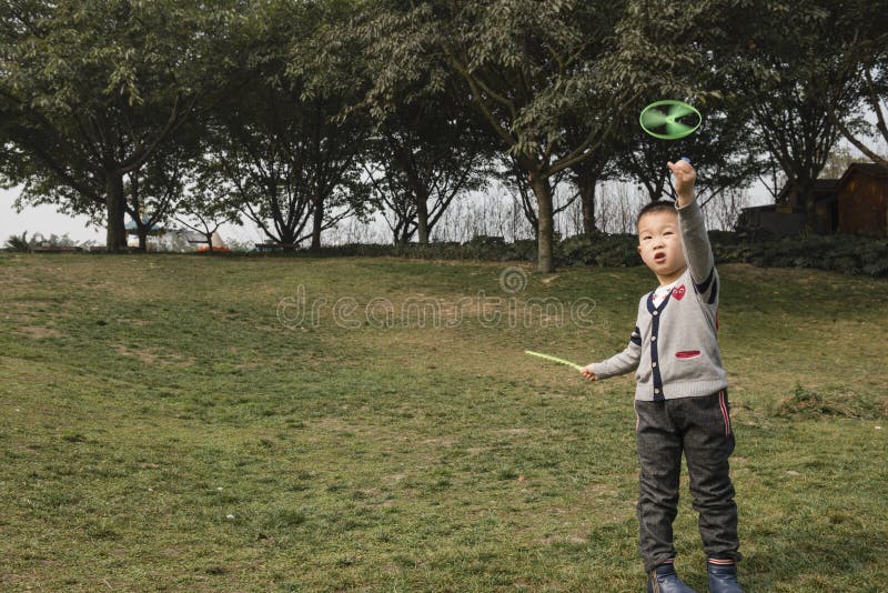 Boy playing frisbee stock image. Image of play, lifestyle - 51533005
