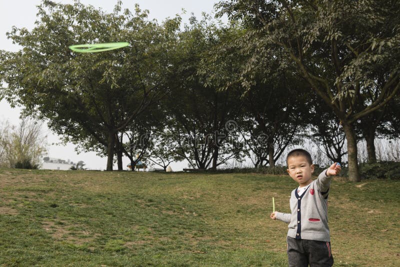 Boy playing frisbee stock image. Image of chinese, lifestyle - 54596161