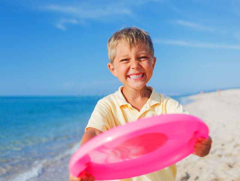 Boy playing frisbee stock image. Image of holiday, activity - 51943953