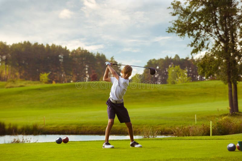 Boy playing golf stock photo. Image of grass, athlete - 103606128
