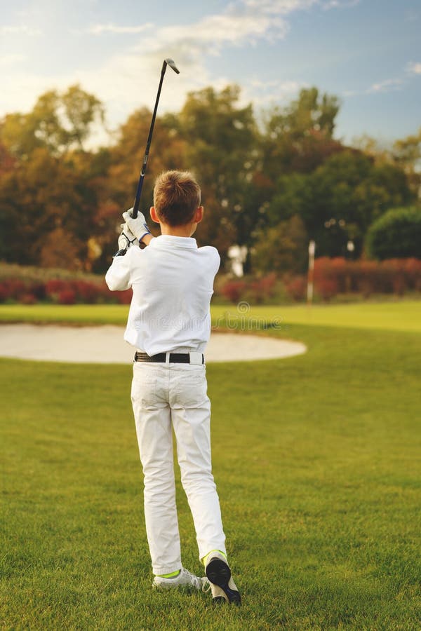 Boy playing golf stock image. Image of outside, club - 78436837