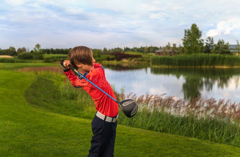 Boy playing golf stock photo. Image of athlete, grass - 122904542