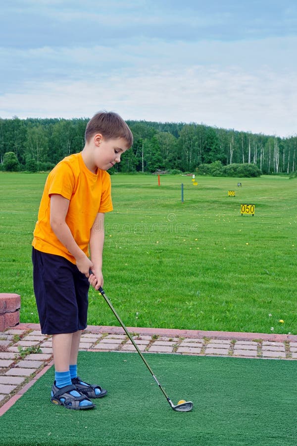 Boy Playing Golf in the Summer Stock Image - Image of summer, swing ...