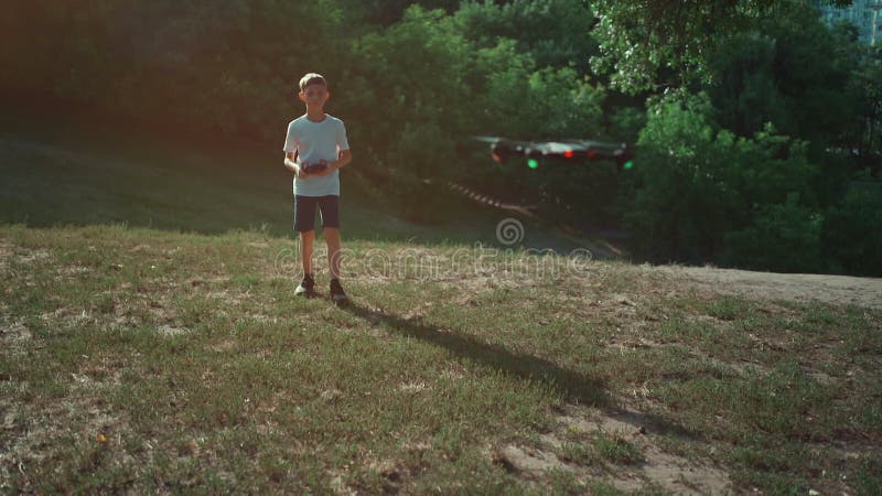 Boy Playing with Helicopter or Operating Drone with Remote Control ...