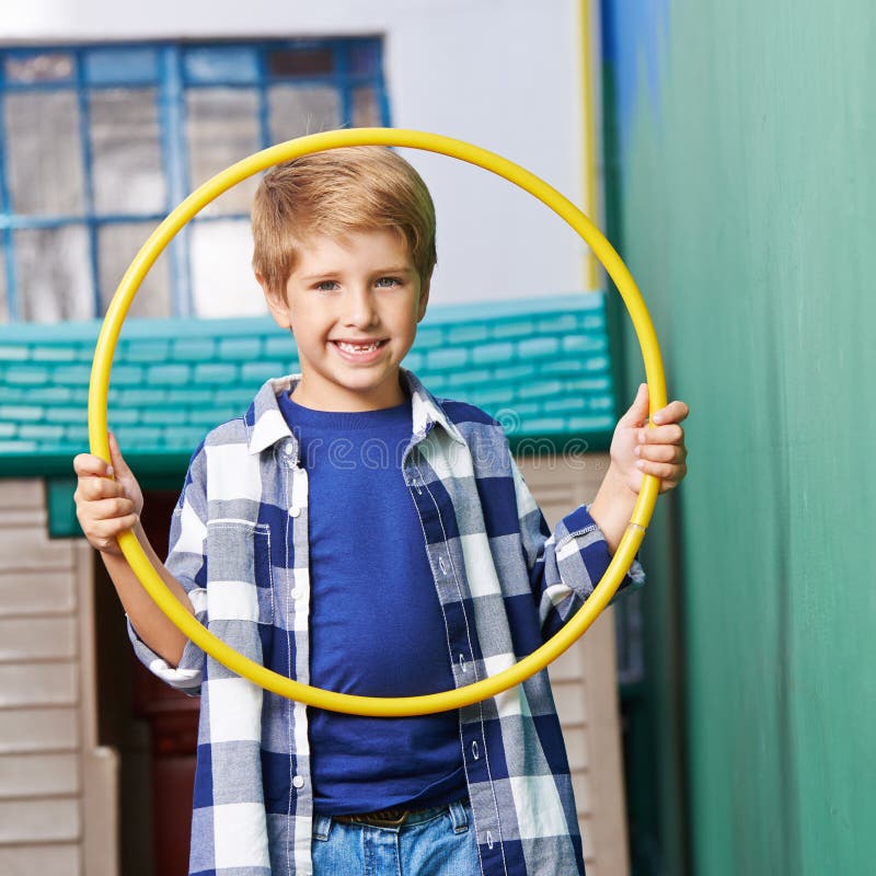 Boy playing with hula hoop stock image. Image of kids - 52053103
