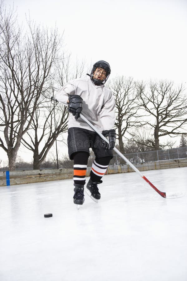Boy playing ice hockey. stock photo. Image of contact - 3469978
