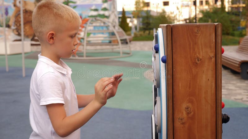 A Boy is Playing Interactive Games on the Playground in the Modern ...
