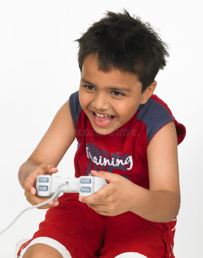 Boy playing with joy stick stock photo. Image of shirt - 6318914