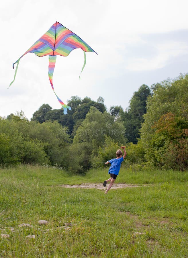 Boy playing with kite stock image. Image of motion, full - 48046873