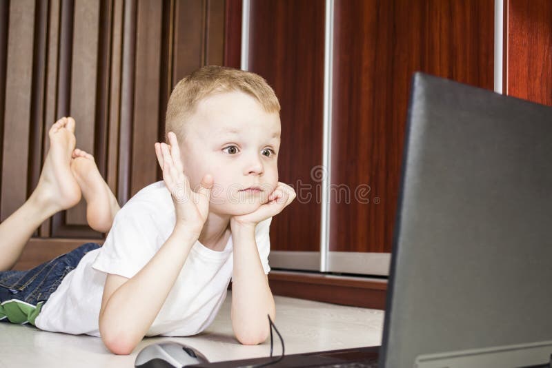 Boy playing laptop stock photo. Image of white, face - 73048436