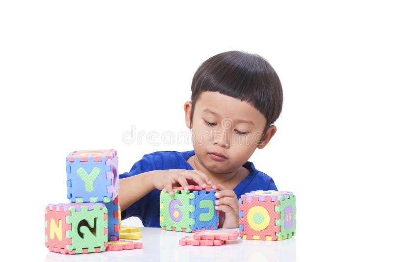 Boy playing with letters stock photo. Image of education - 43156544