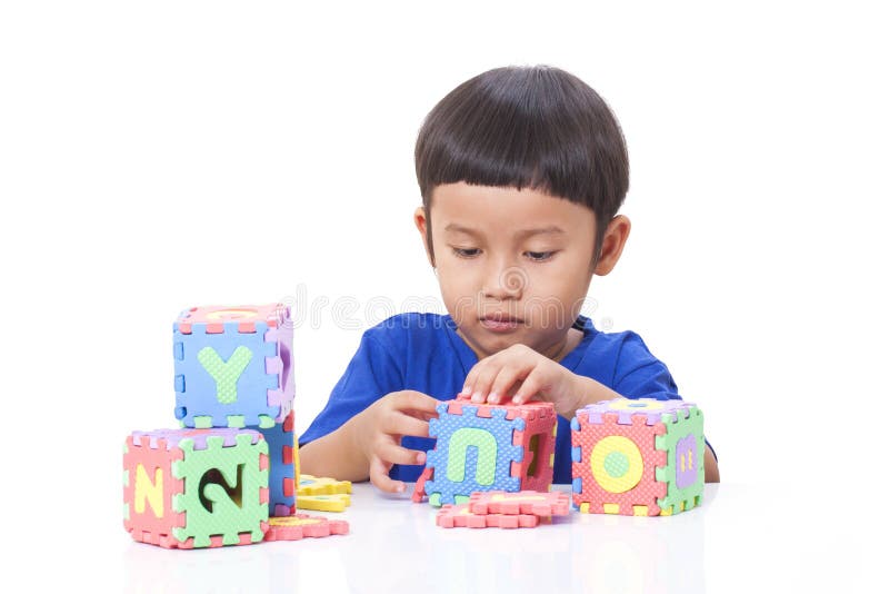 Boy playing with letters stock photo. Image of education - 43156544