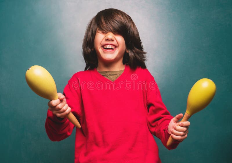 Boy Playing the Maracas in the School Stock Photo - Image of closeup ...