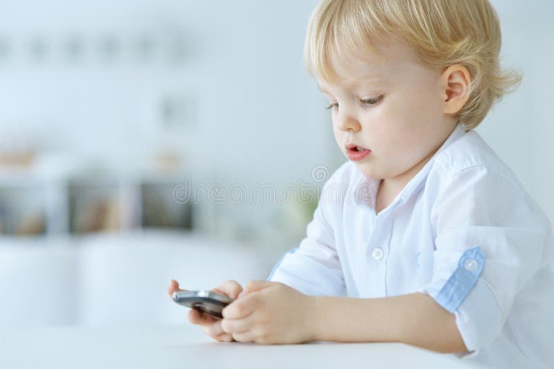 Boy is Playing with a Mobile Phone Stock Photo - Image of smartphone ...