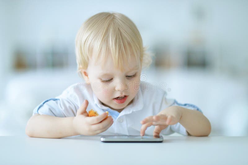 Boy is Playing with a Mobile Phone Stock Photo - Image of cellphone ...