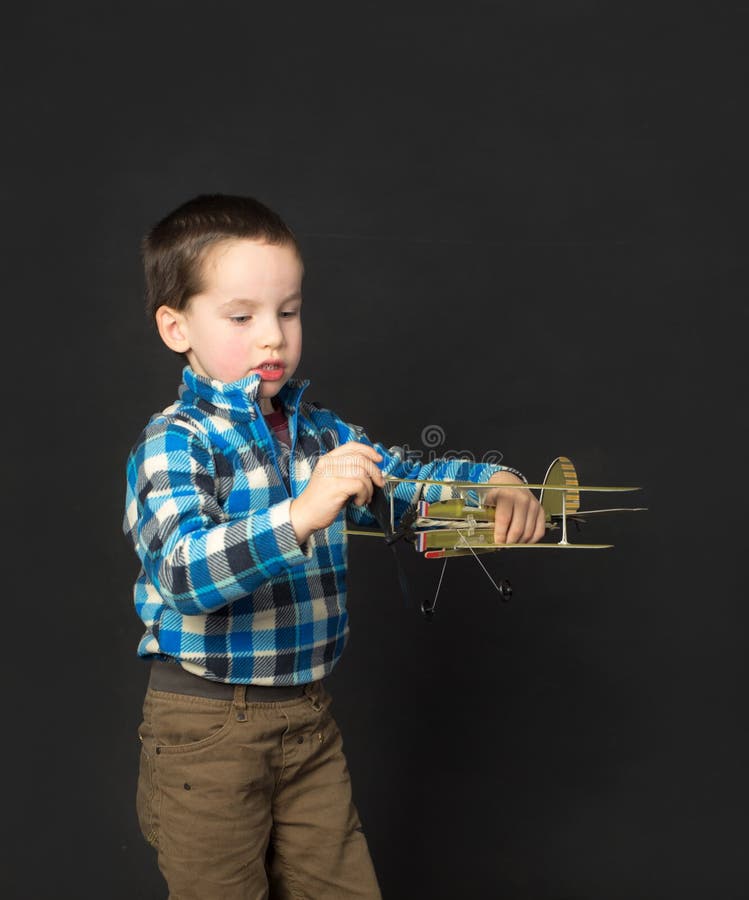 Boy Playing with a Model Airplane Stock Photo - Image of caucasian ...