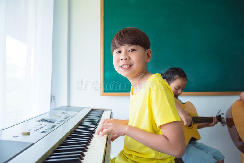 Boy Playing Music Keyboard at School Stock Photo - Image of student ...