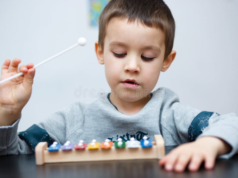Boy is Playing a Musical Instrument Stock Image - Image of leisure ...