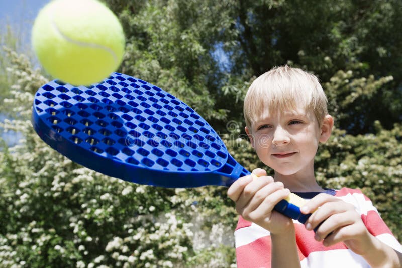 Boy Playing with Paddle and Ball Stock Image - Image of hitting ...