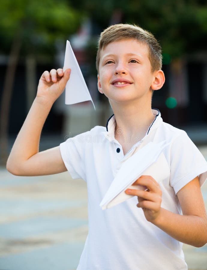 Boy Playing with Paper Airplane Stock Photo - Image of happiness ...