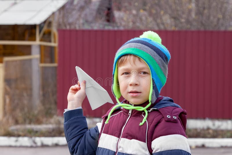 Boy Playing with Paper Plane Stock Image - Image of airplane, pilot ...