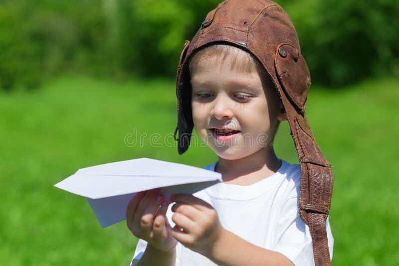 Boy Playing with a Paper Plane Stock Photo - Image of happy, helmet ...