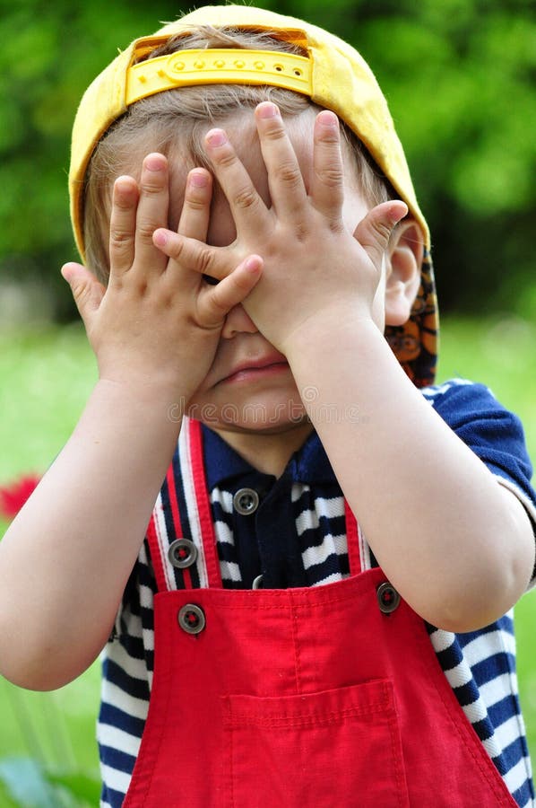 Boy Playing Peek-a-boo Outdoors Stock Image - Image of peekaboo ...