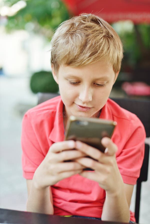 Boy playing phone stock image. Image of smart, phone - 61264253