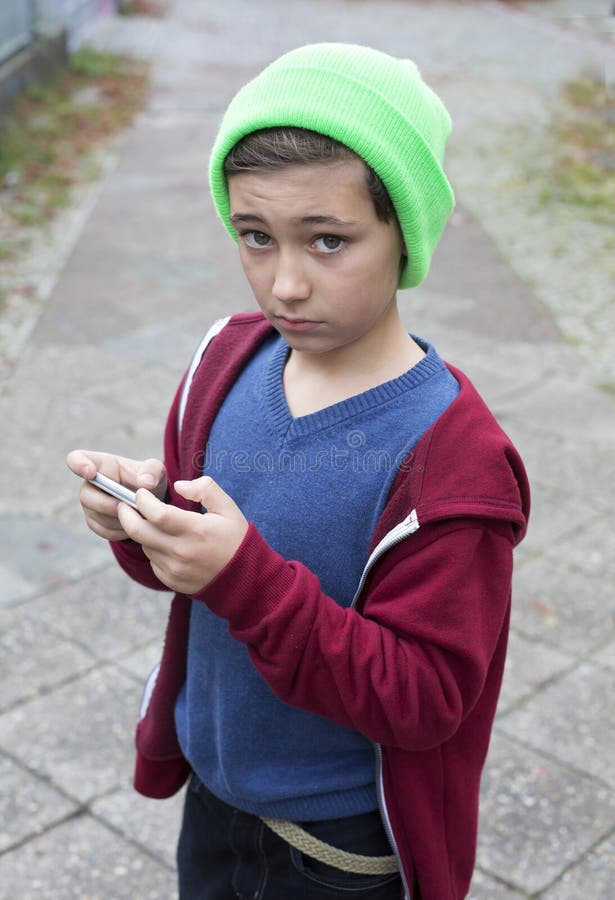 Boy playing on phone stock image. Image of portrait, young - 45652359