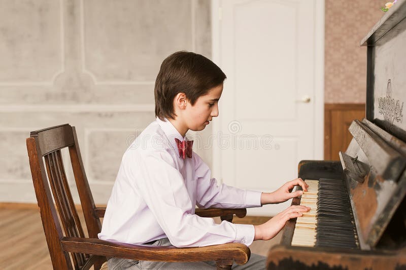 Boy Playing Piano stock photo. Image of people, playing - 43830364