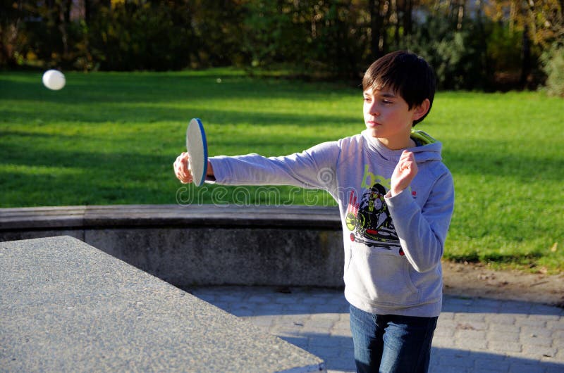 Boy playing ping pong stock image. Image of handsome - 46562913